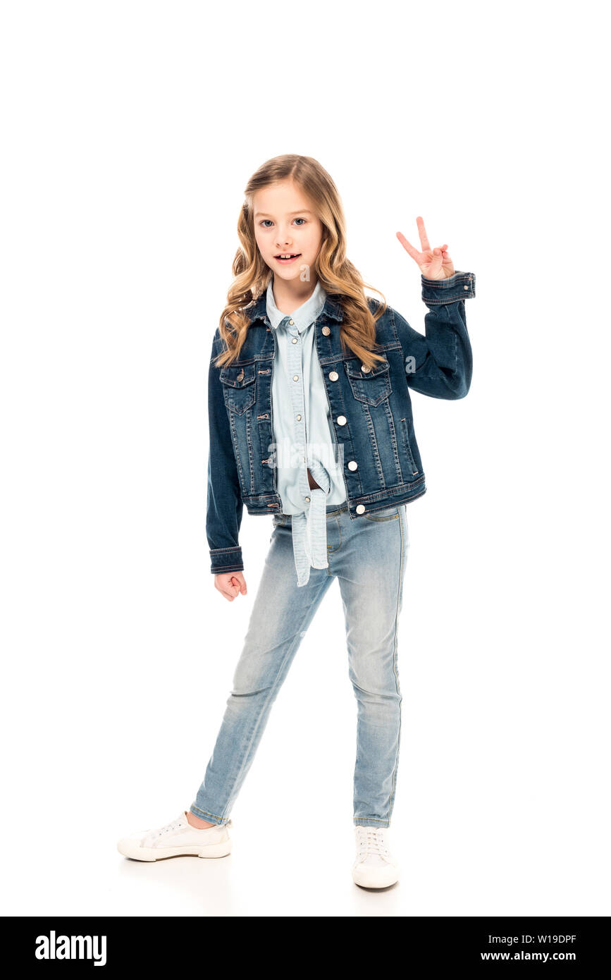 full length view of kid in jeans showing peace sign on white Stock ...
