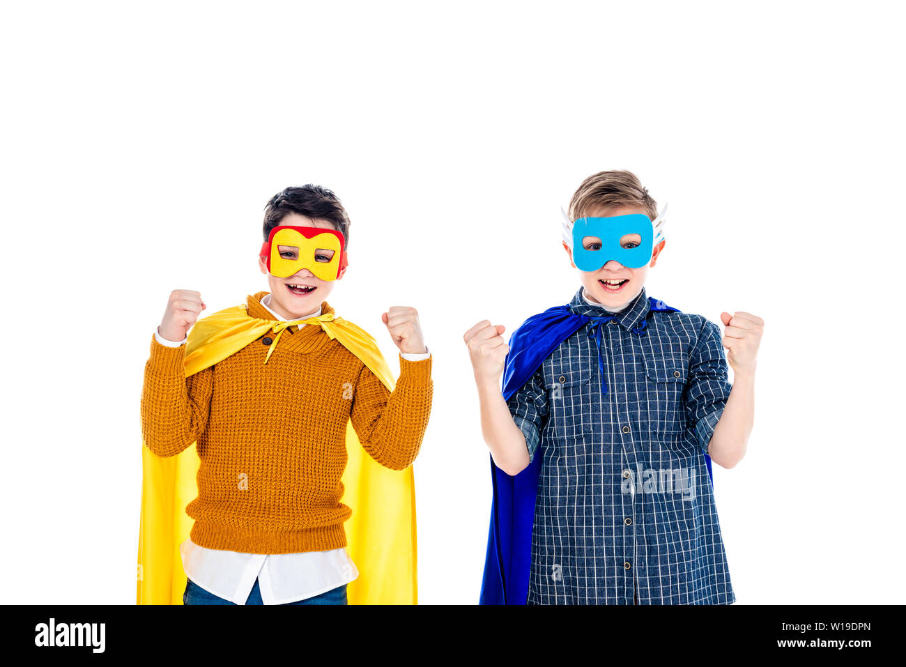happy boys in superhero costumes cheering with clenched fists Isolated ...