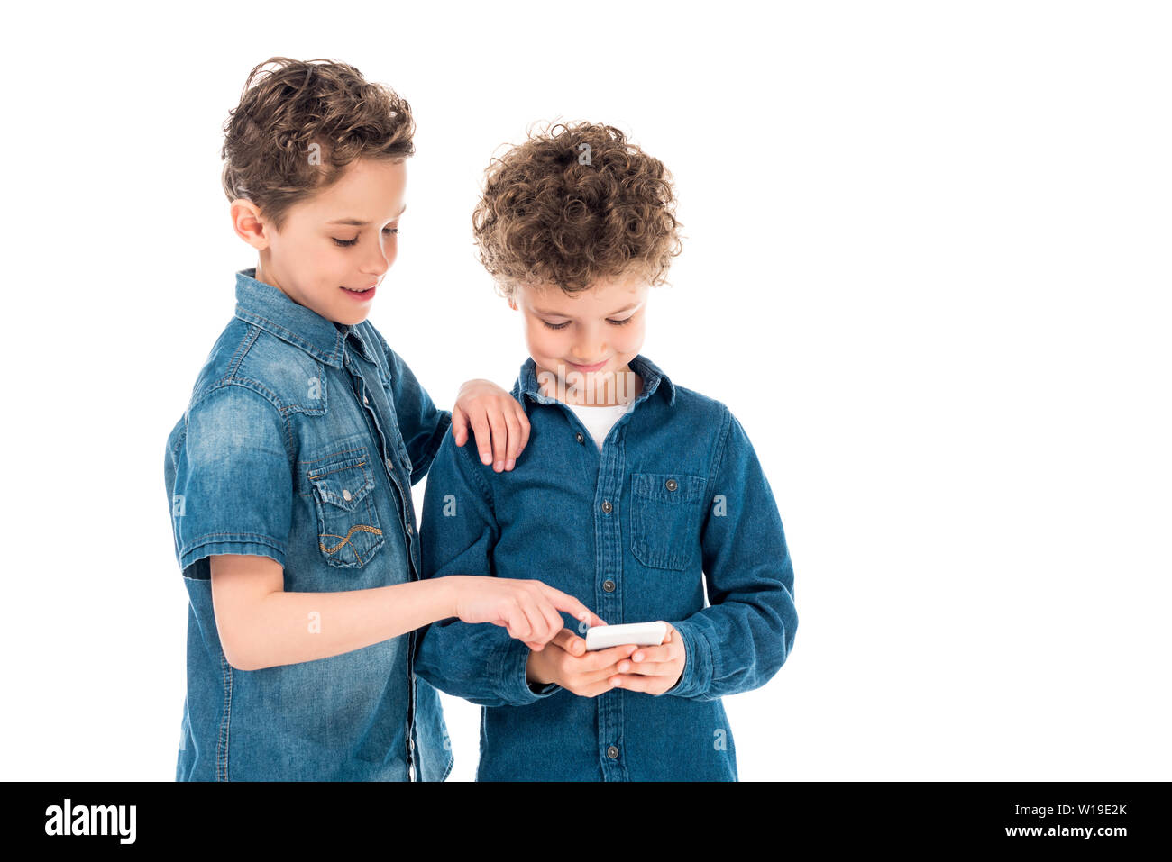 Two children in white shirts hi-res stock photography and images - Alamy