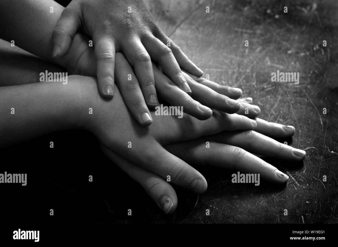Group hands family Black and White Stock Photos & Images - Alamy