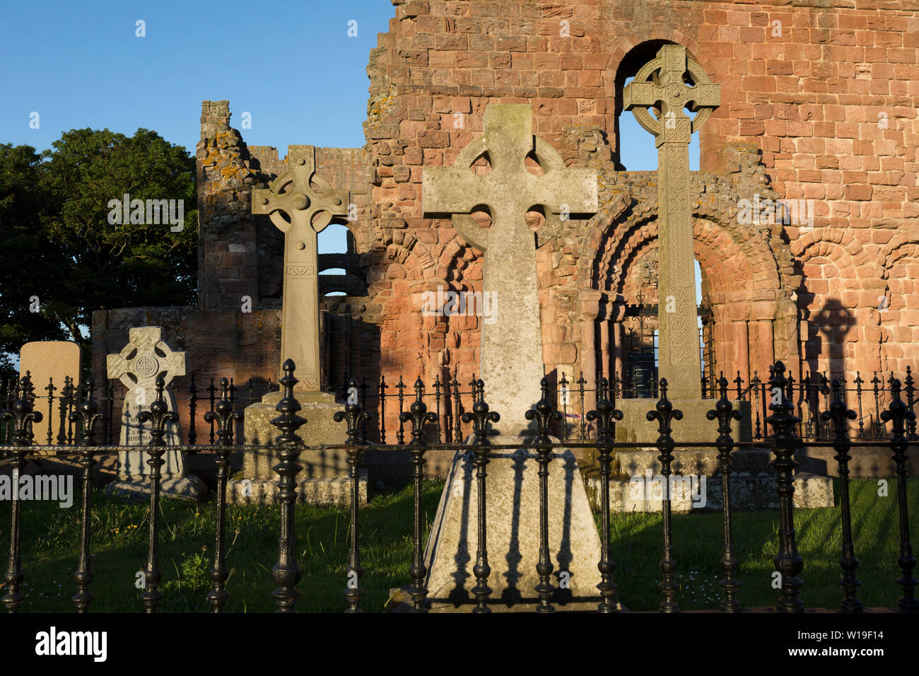 The ruined monastery walls of Lindisfarne priory on Holy Island, on ...