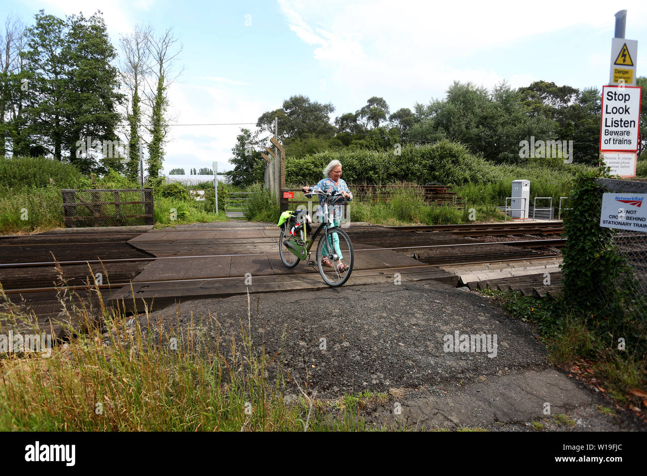 General views of a small public train crossing in Yapton, West Sussex ...