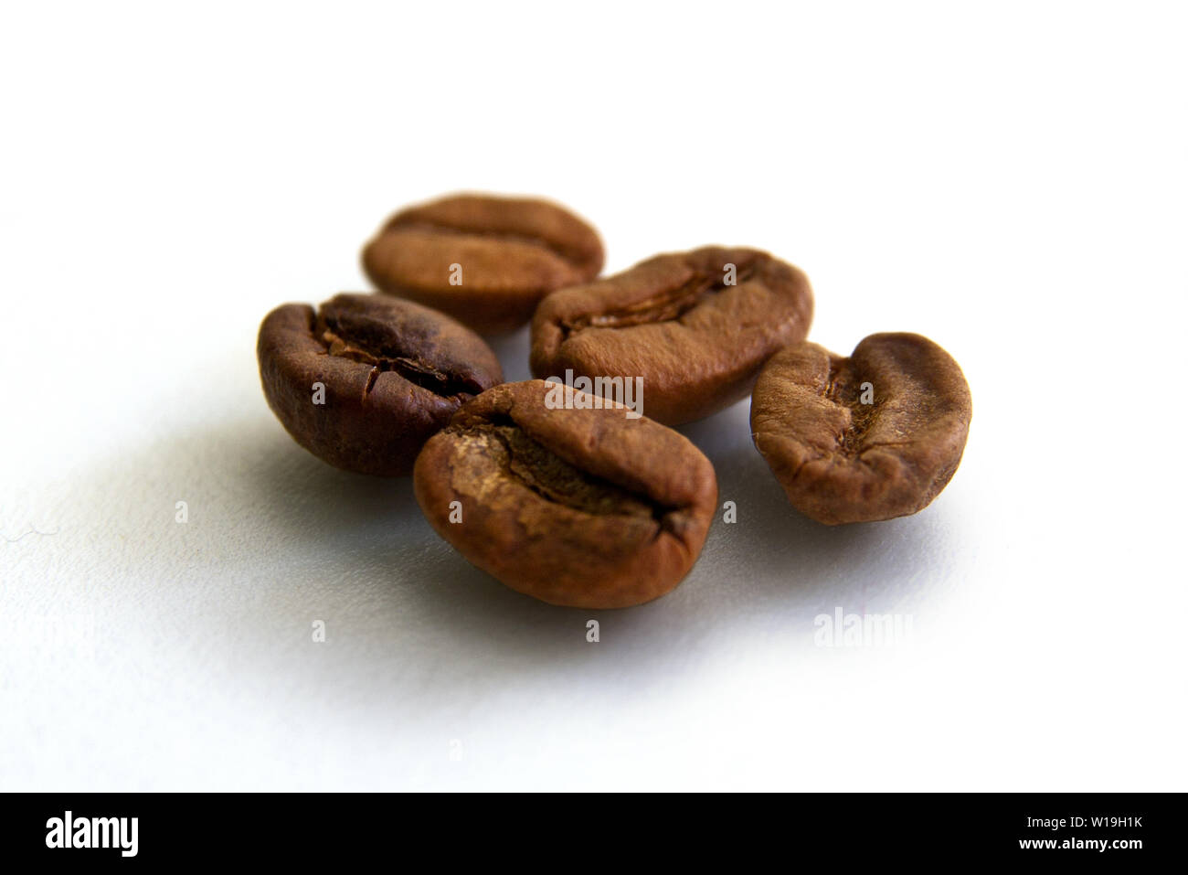 Coffee beans isolated on white Stock Photo - Alamy