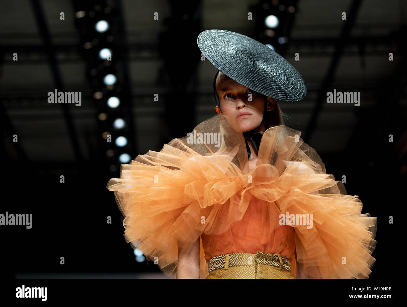 Berlin, Germany. 01st July, 2019. A model presents the fashion of the ...