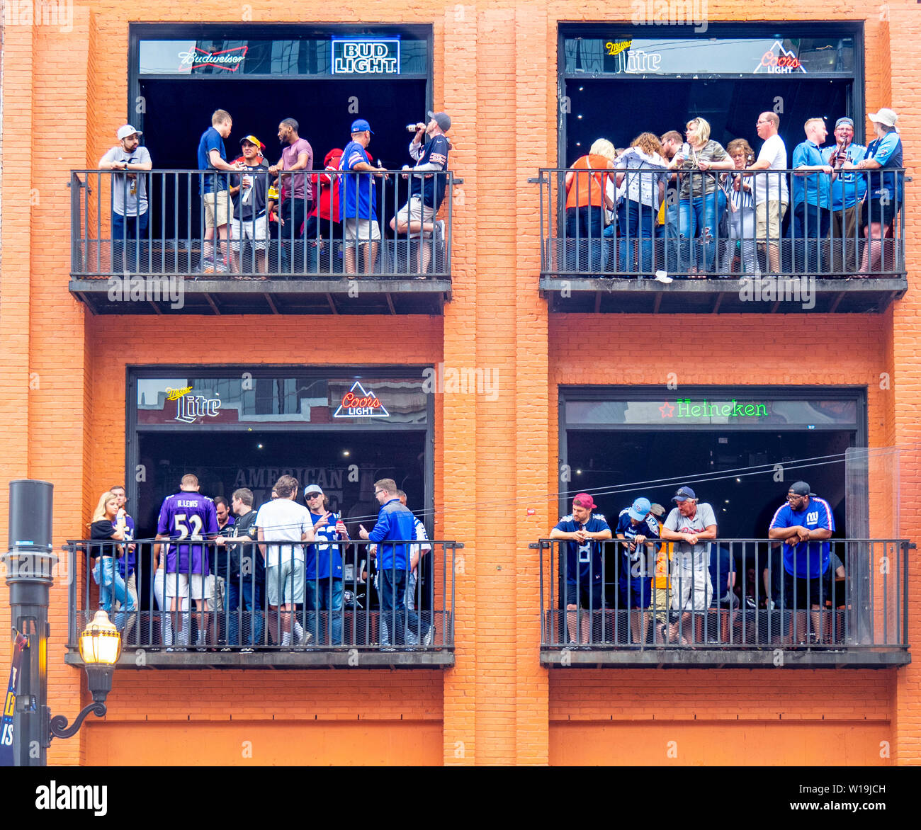 Football fans standing on the balconies of Honky Tonk Central on ...