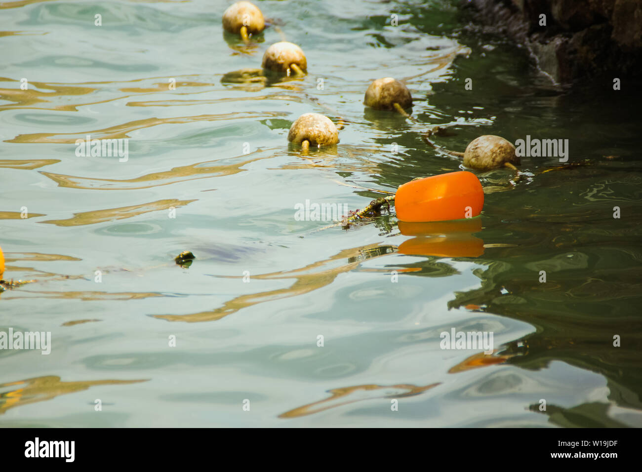 Orange buoy gray Keep available safety float marker Stock Photo - Alamy