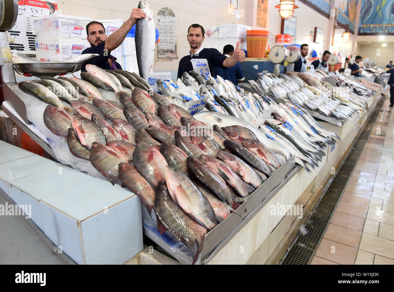 Kuwait City, Kuwait. 1st July, 2019. Fish vendors wait for customers at ...