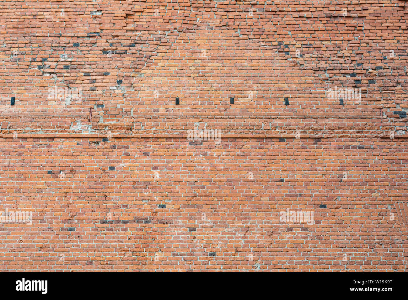 Old damaged worn brick wall background Stock Photo - Alamy