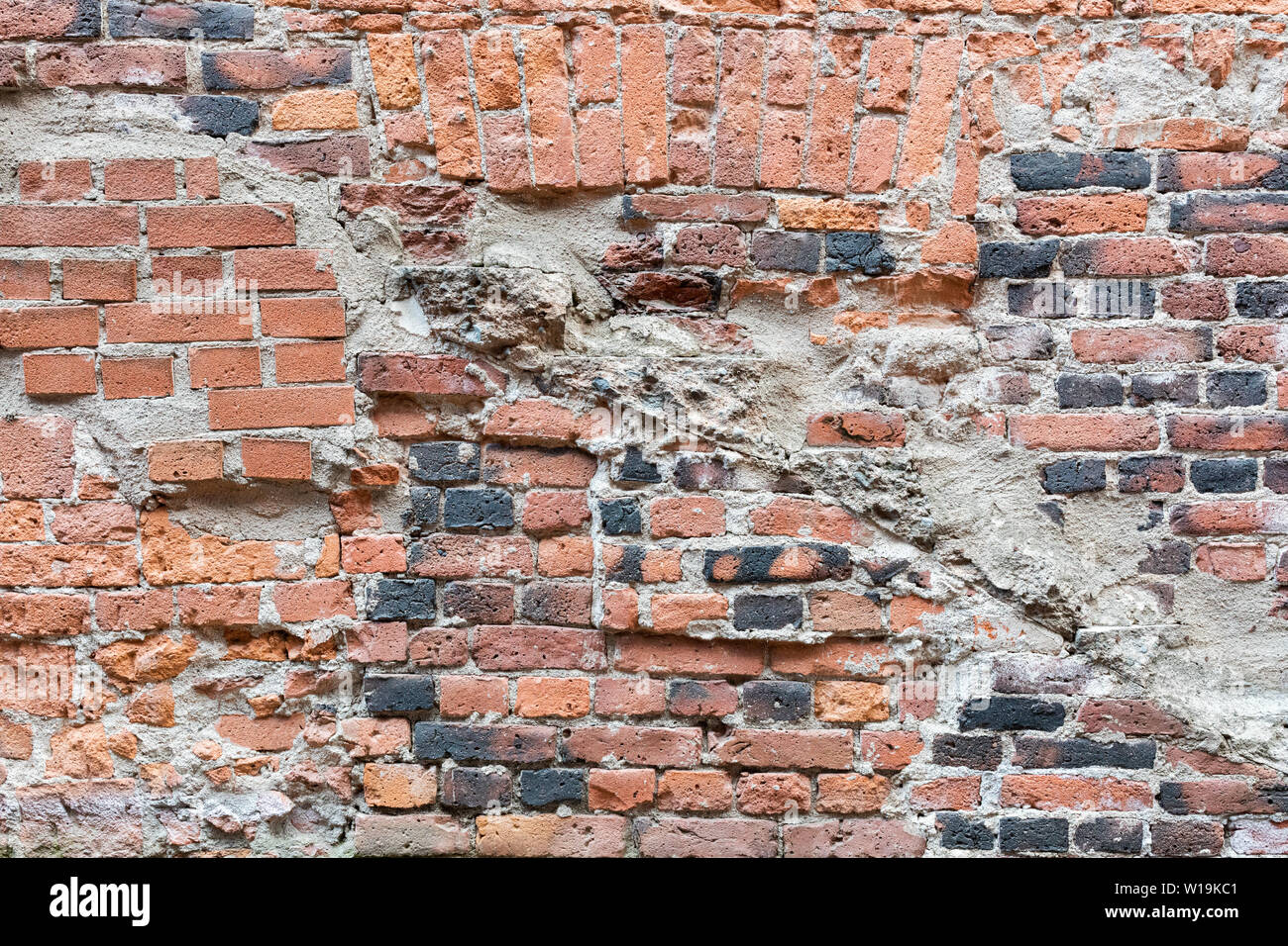 Old damaged worn brick wall background Stock Photo - Alamy