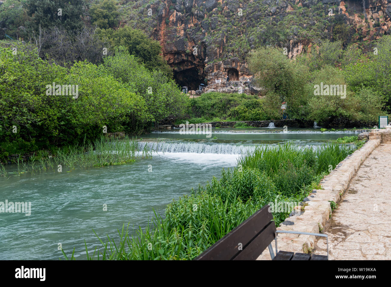 In the background of the Banias Spring is Pan's Cave, where the ...