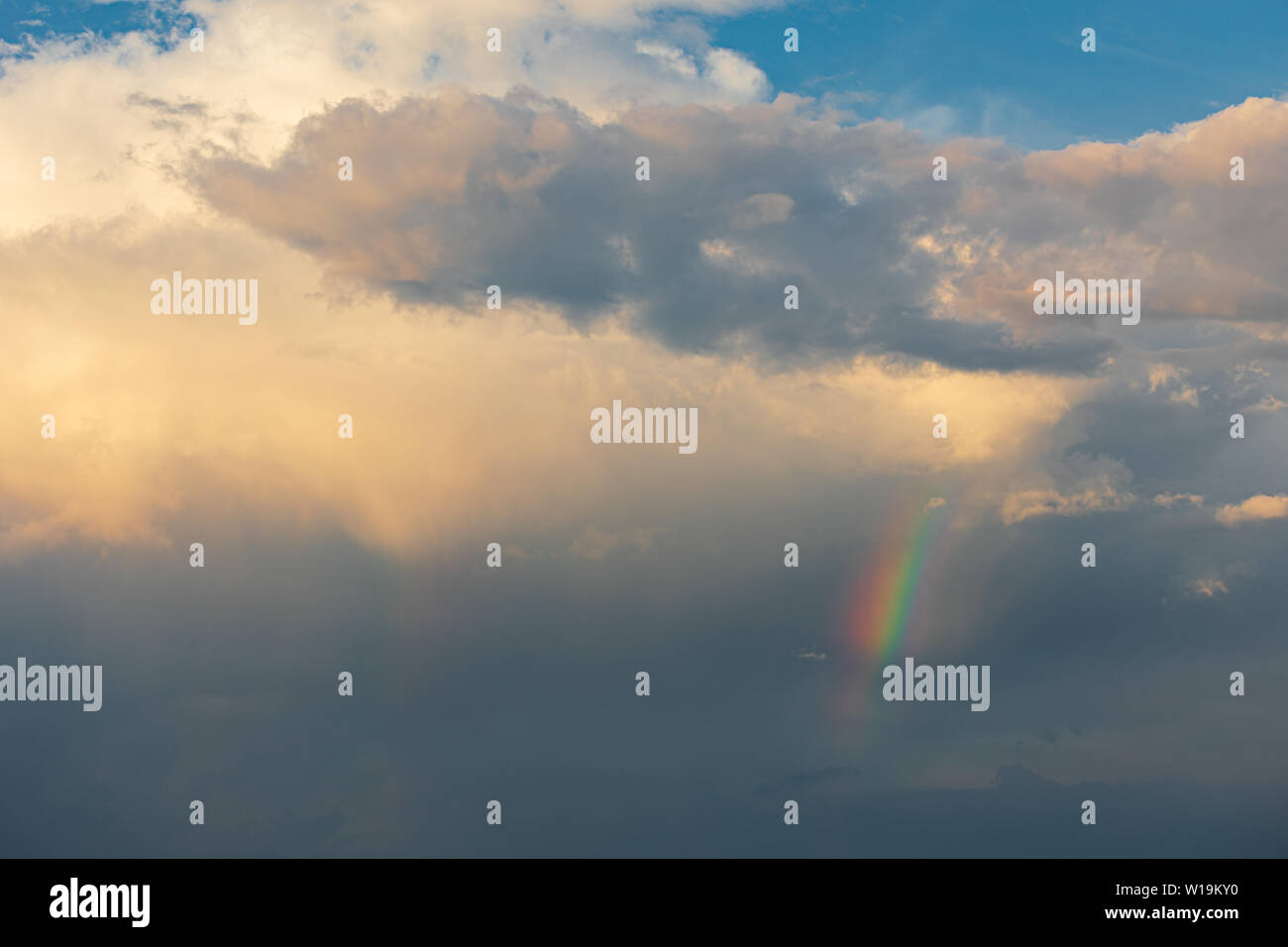 Cumulus cloud rainbow hi-res stock photography and images - Alamy