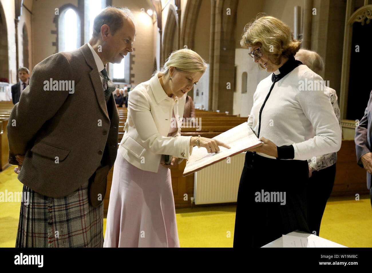 The Earl and Countess of Forfar alongside Rev Elaine Garman inside the ...