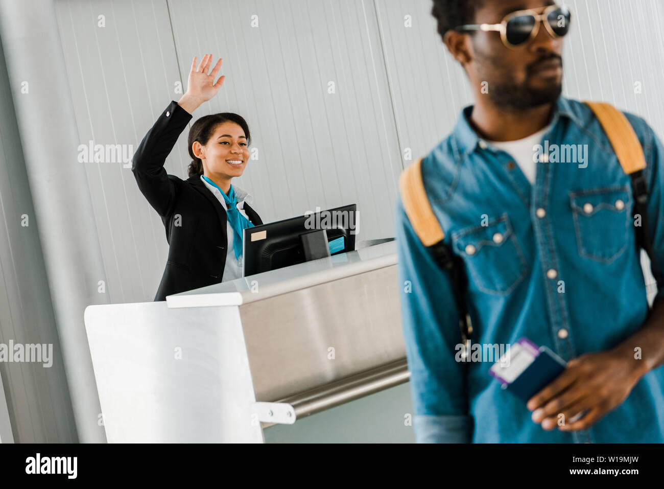 Worker waving hi-res stock photography and images - Alamy
