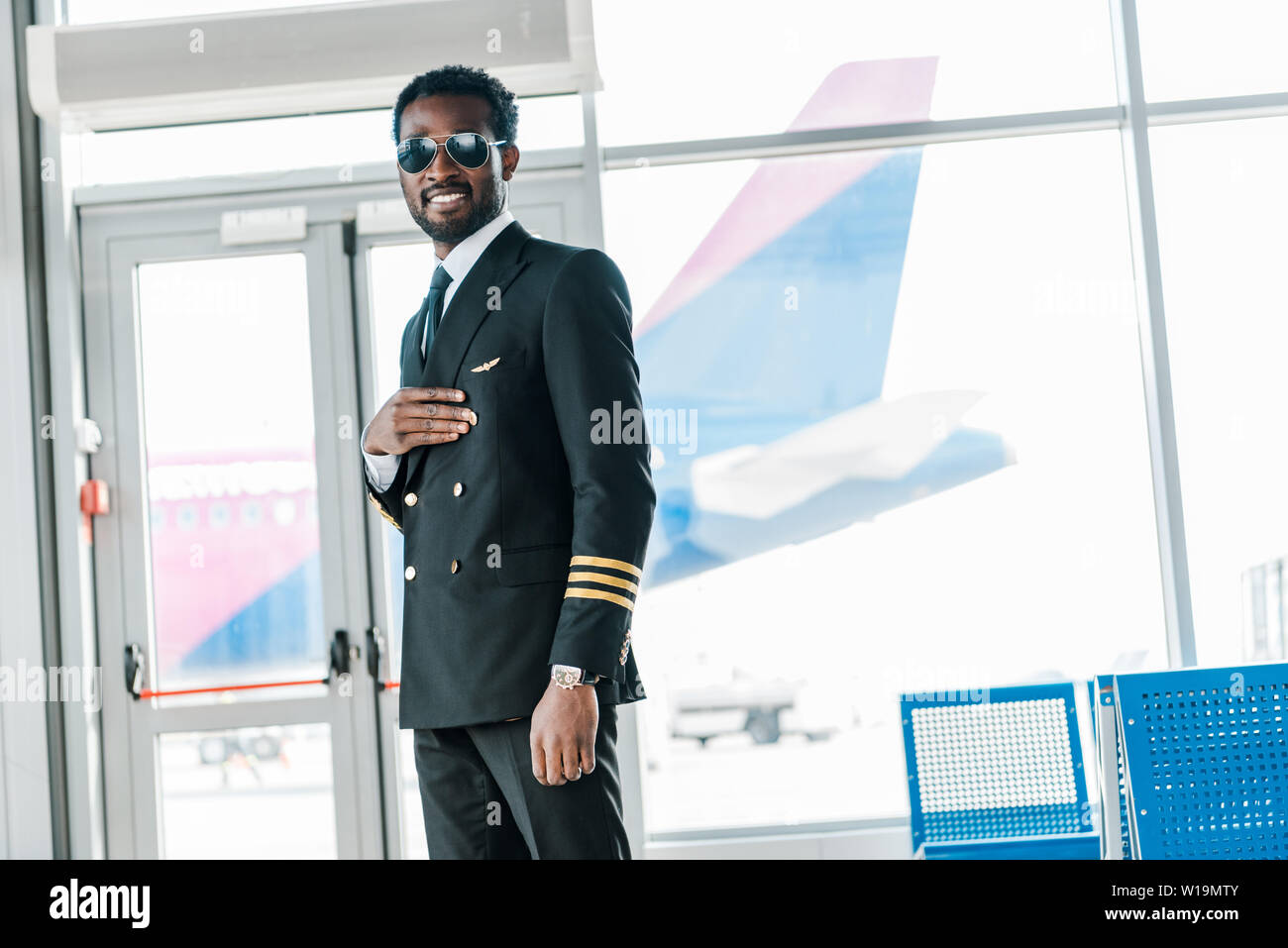 Cheerful african american pilot in hi-res stock photography and images ...