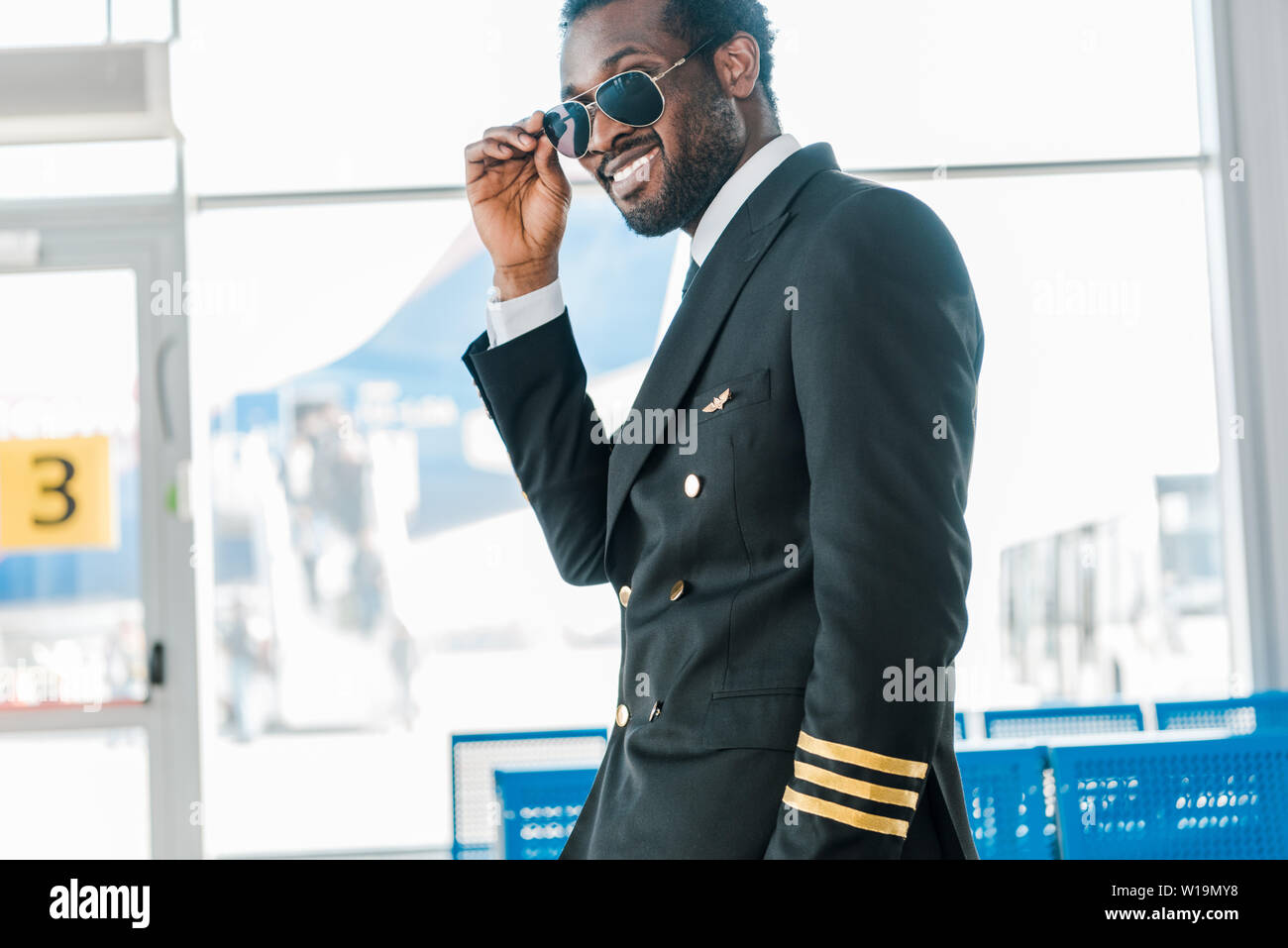 Cheerful african american pilot in hi-res stock photography and images ...
