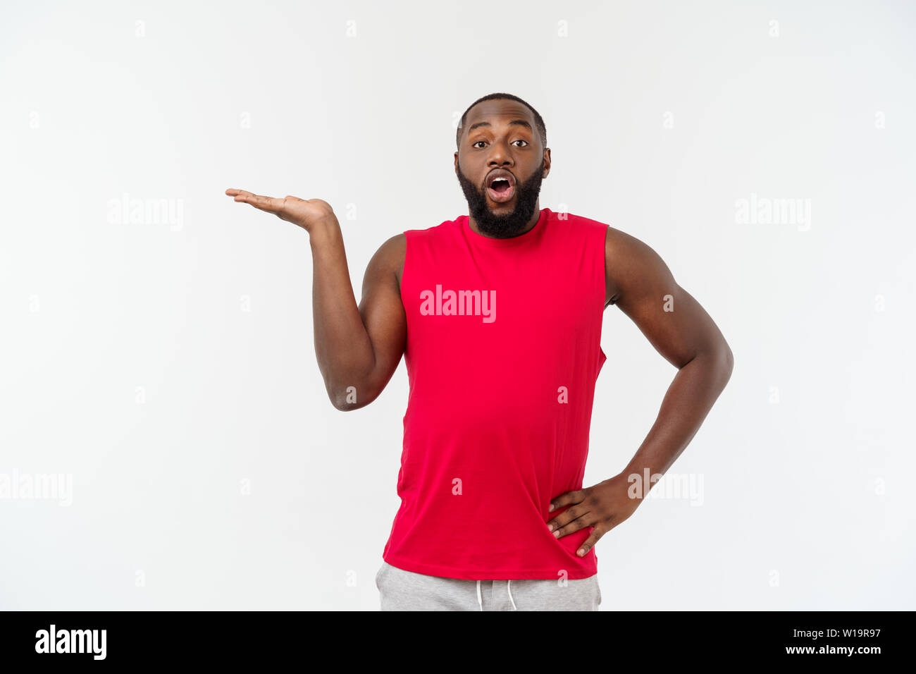 Young sport african american man extending hands to the side for ...