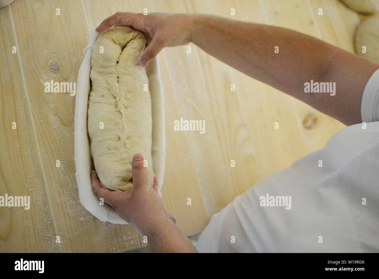 Hand holding bread butter making hi-res stock photography and images ...