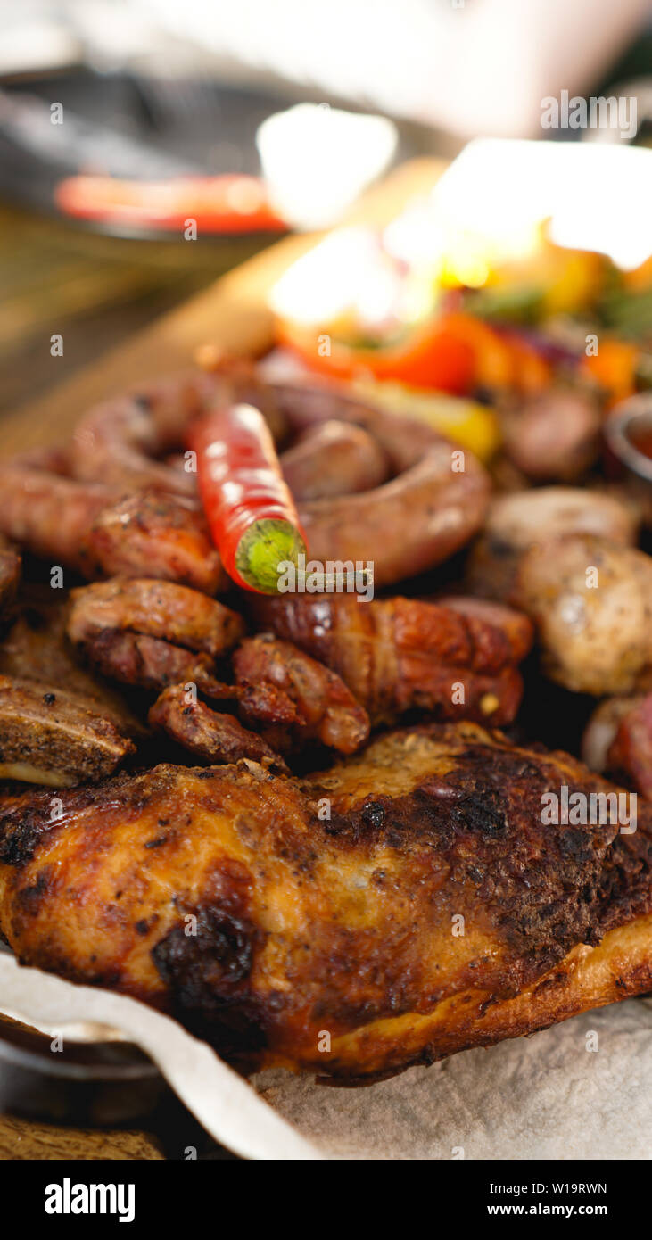 Mixed grilled meat platter. Assorted delicious grilled meat with vegetable. Mixed grilled meat ...