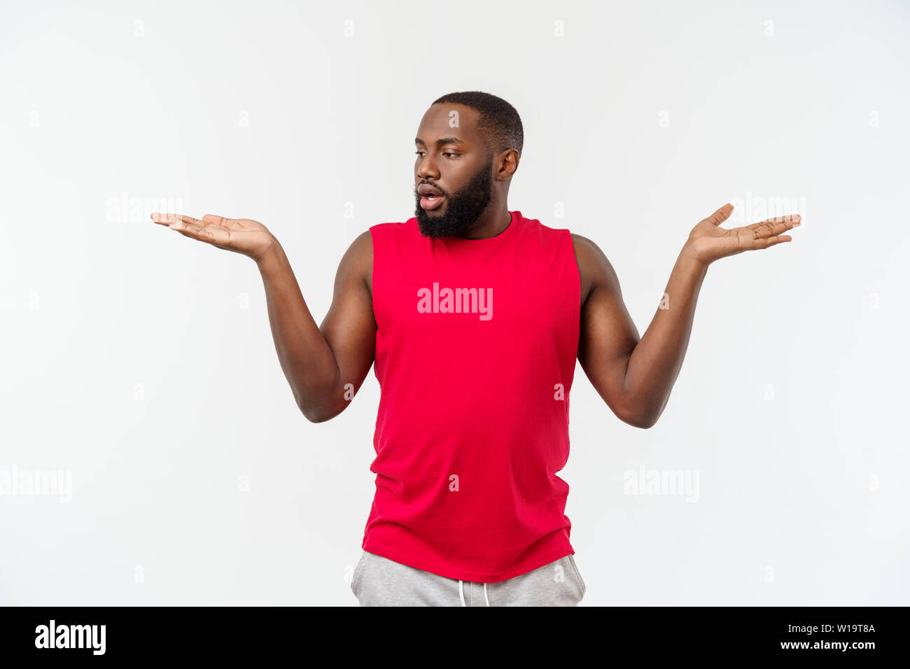 Young sport african american man extending hands to the side for ...