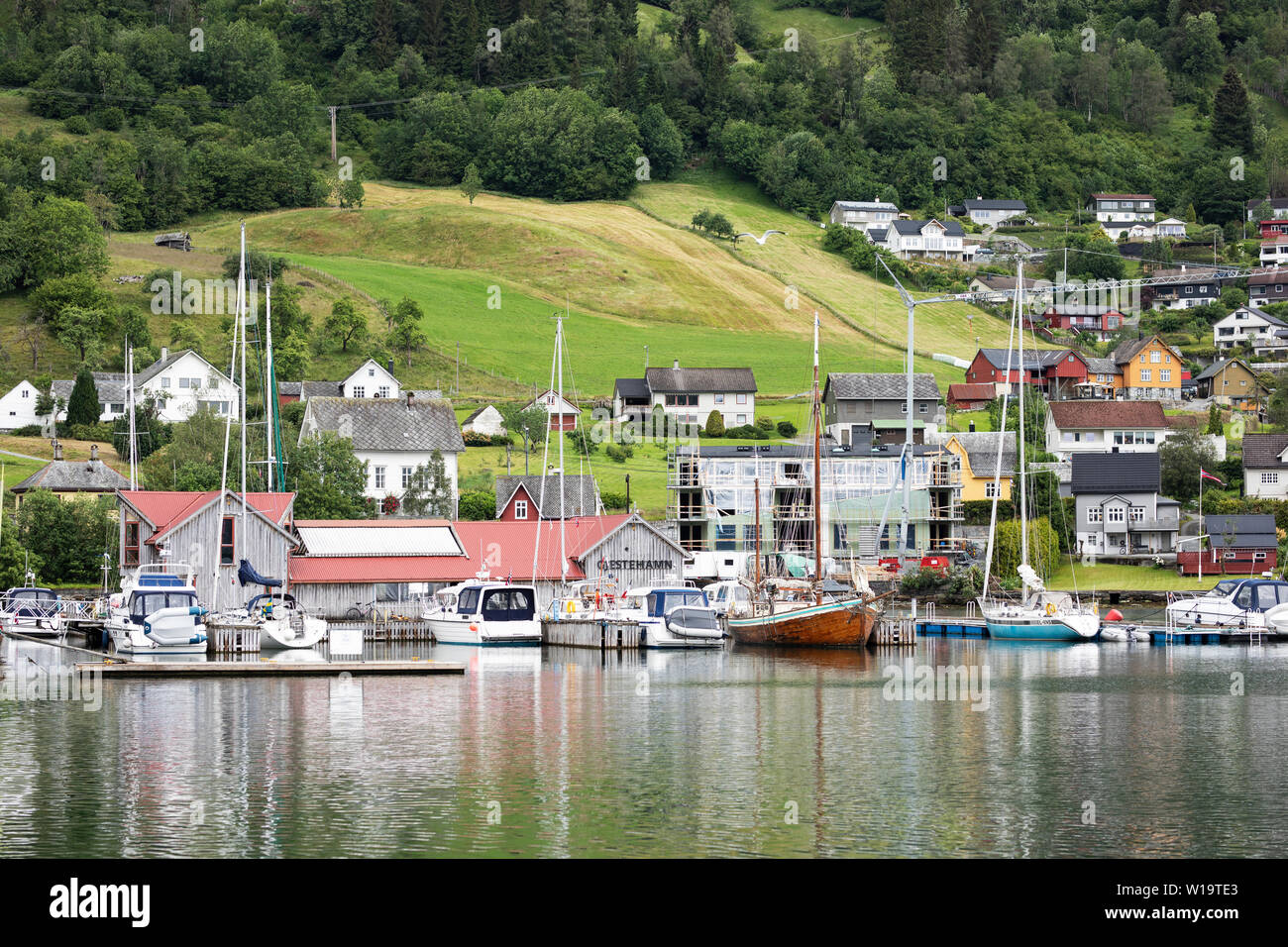 The marina surrounded by houses in the town of Norheimsund, Norway, in ...