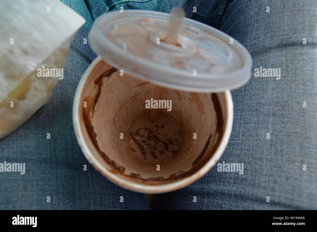 Empty chocolate, chocolate chip milkshake in a white cup Stock Photo ...