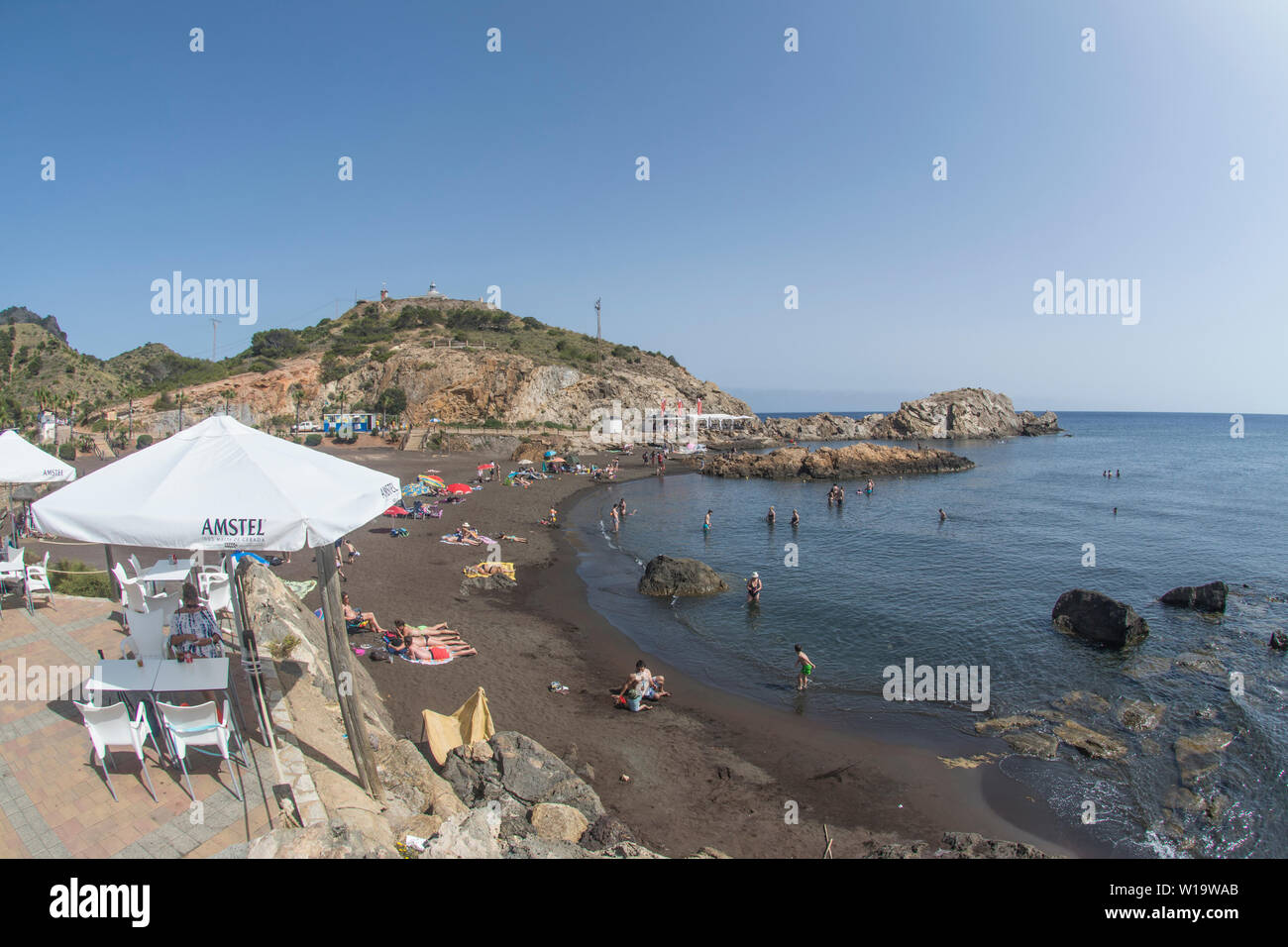 Black sand beach at Portman in Murcia, Spain Stock Photo - Alamy