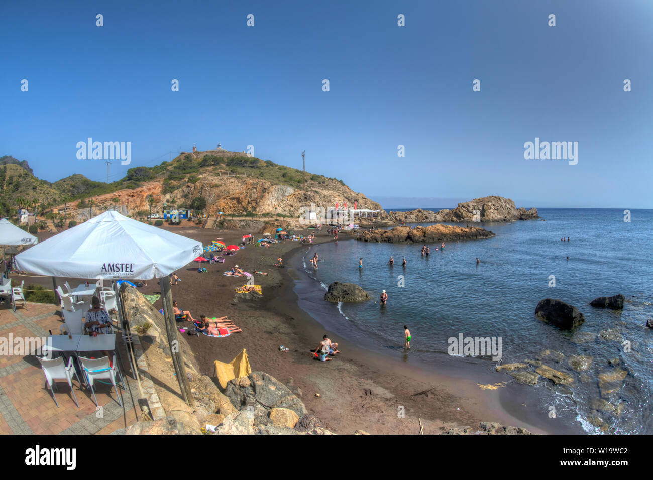 HDR image of the Black sand beach at Portman in Murcia, Spain Stock ...