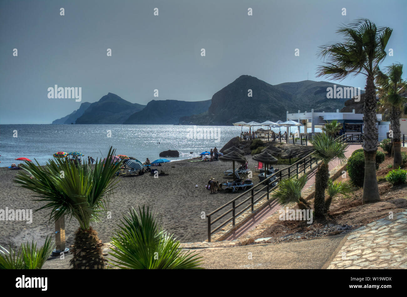 HDR image of the Black sand beach at Portman in Murcia, Spain Stock ...