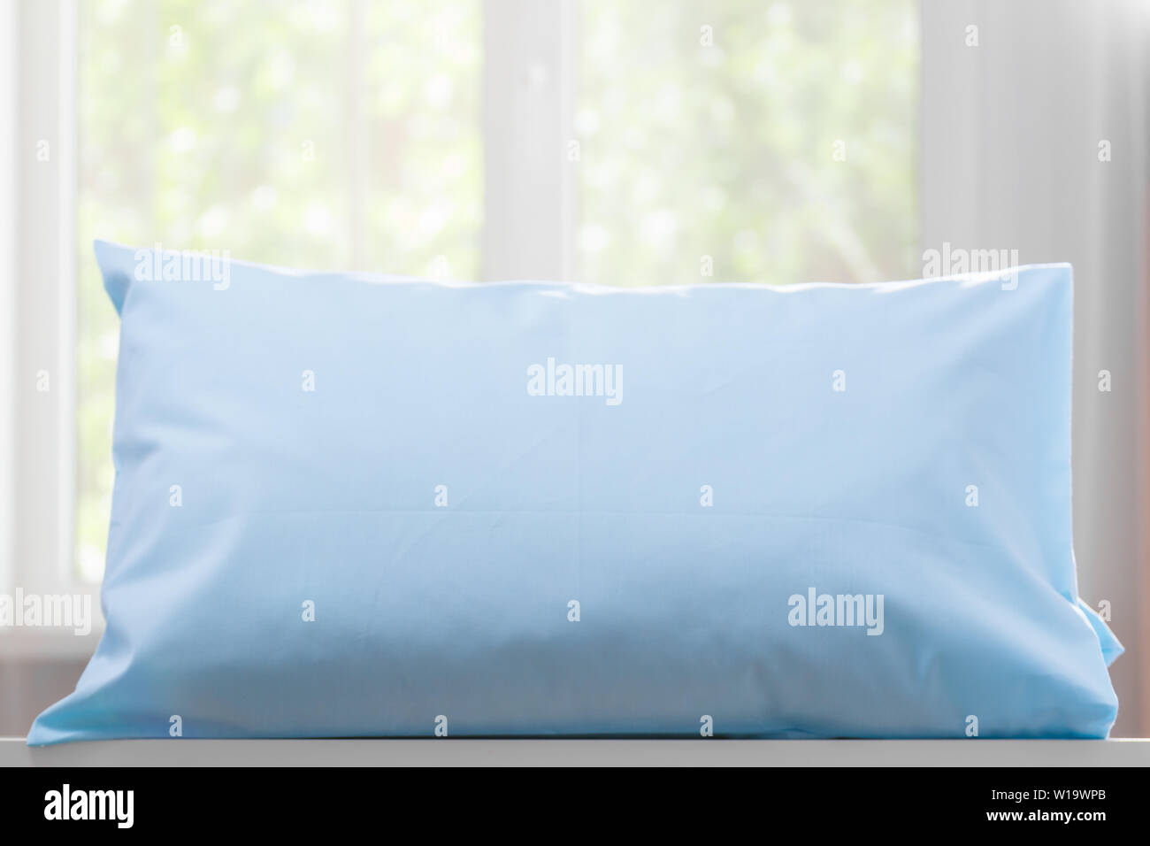 Closeup pillow on blurred window background. Household Stock Photo - Alamy