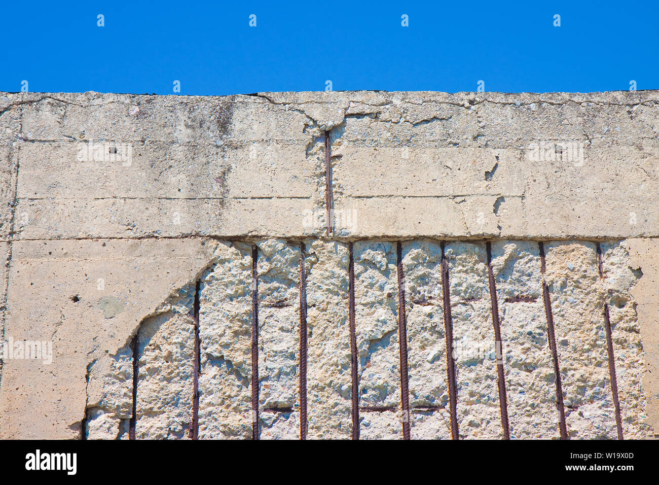 Old reinforced concrete structure with damaged and rusty metallic ...