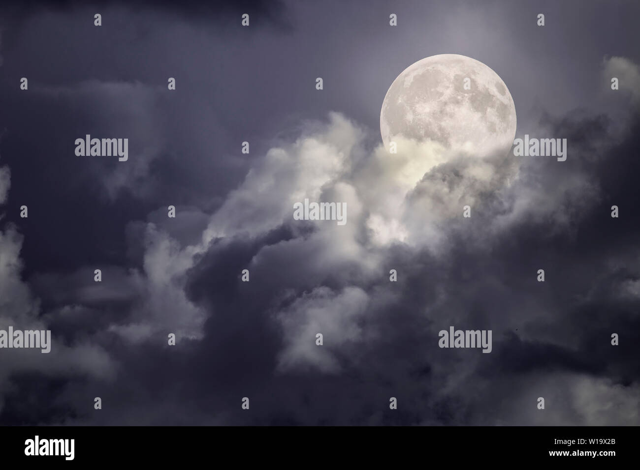 Overcast full moon night sky Stock Photo - Alamy