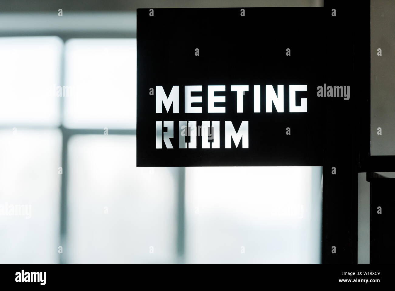 black metallic board with meeting room lettering in modern office Stock ...