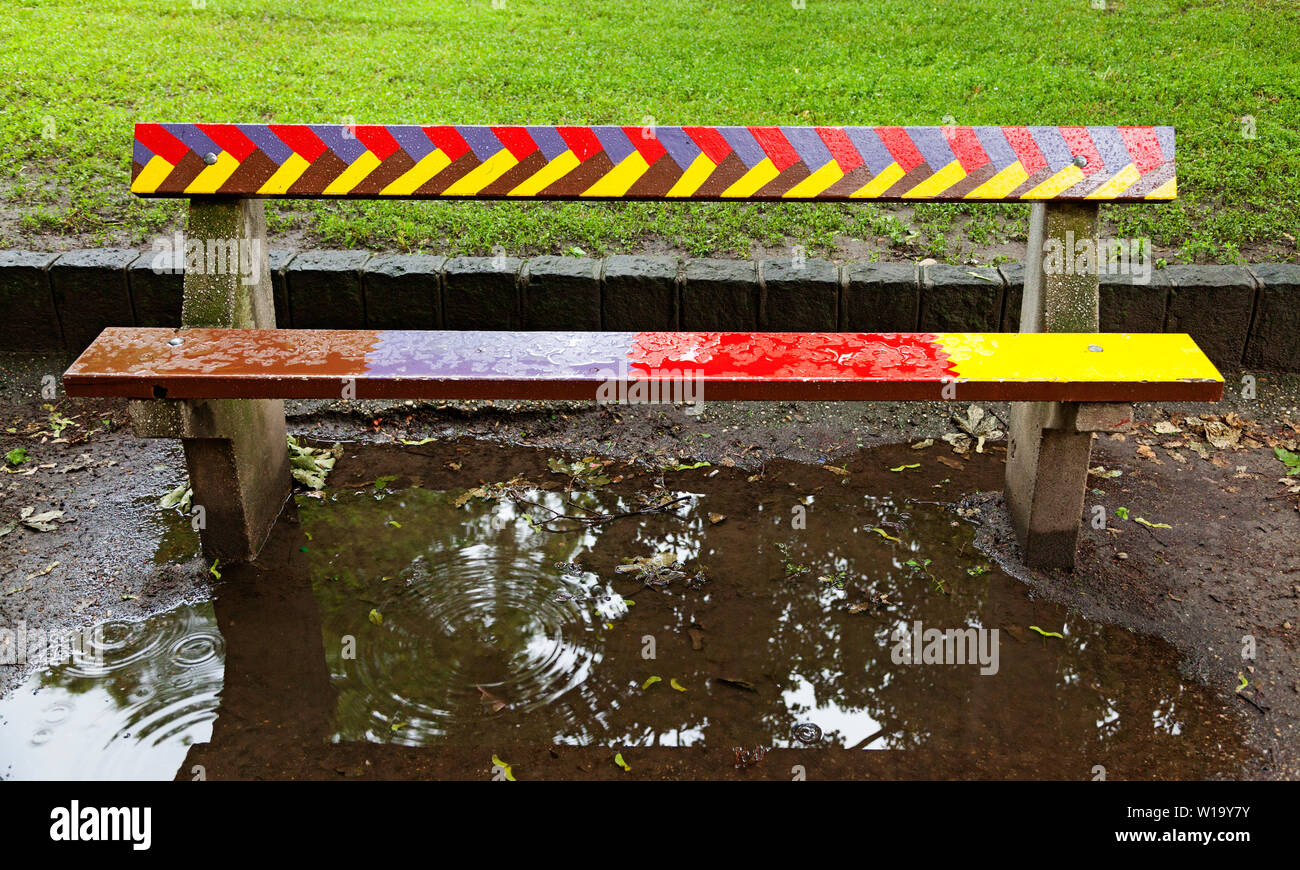 colorful park bench in rainy Budapest Stock Photo - Alamy