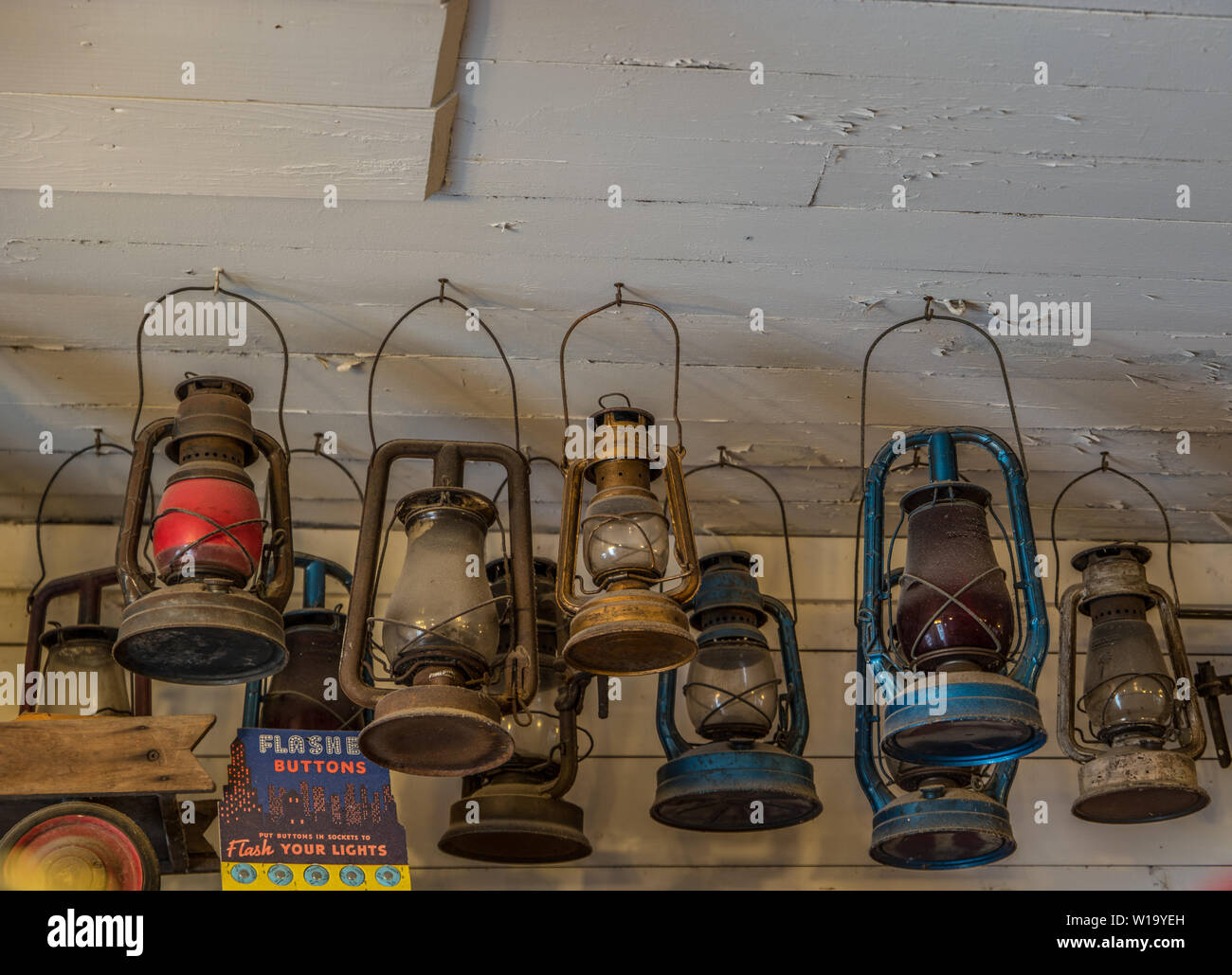 Vintage lanterns of different styles hanging on display from the ...