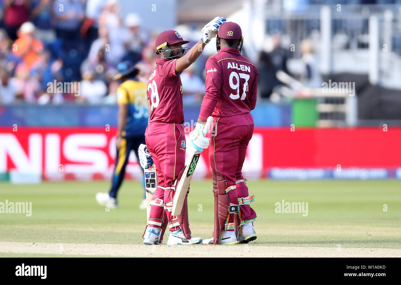 West Indies' Fabian Allen (right) celebrates reaching his half century ...