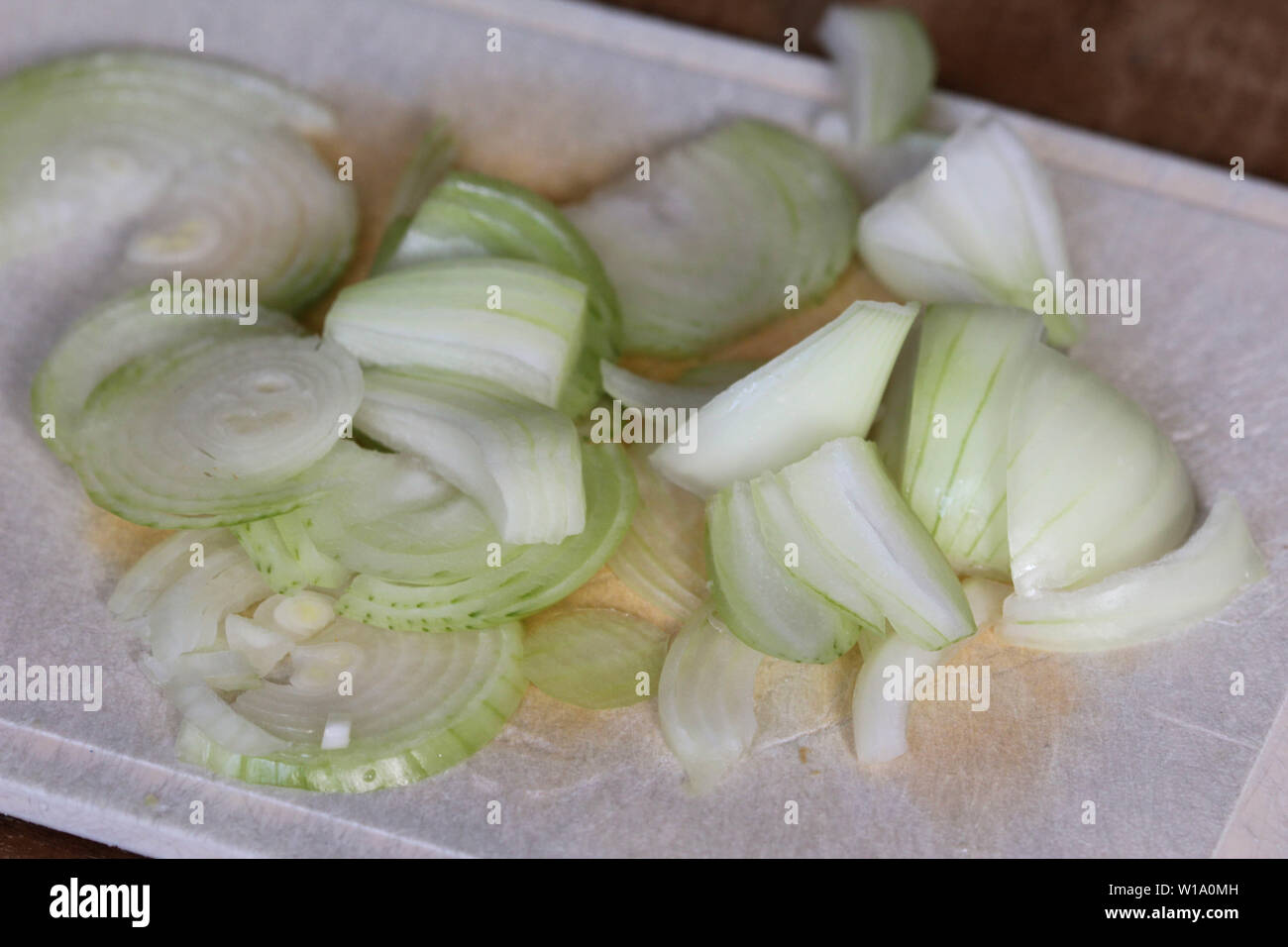 Woman chopping white onion hi-res stock photography and images - Alamy
