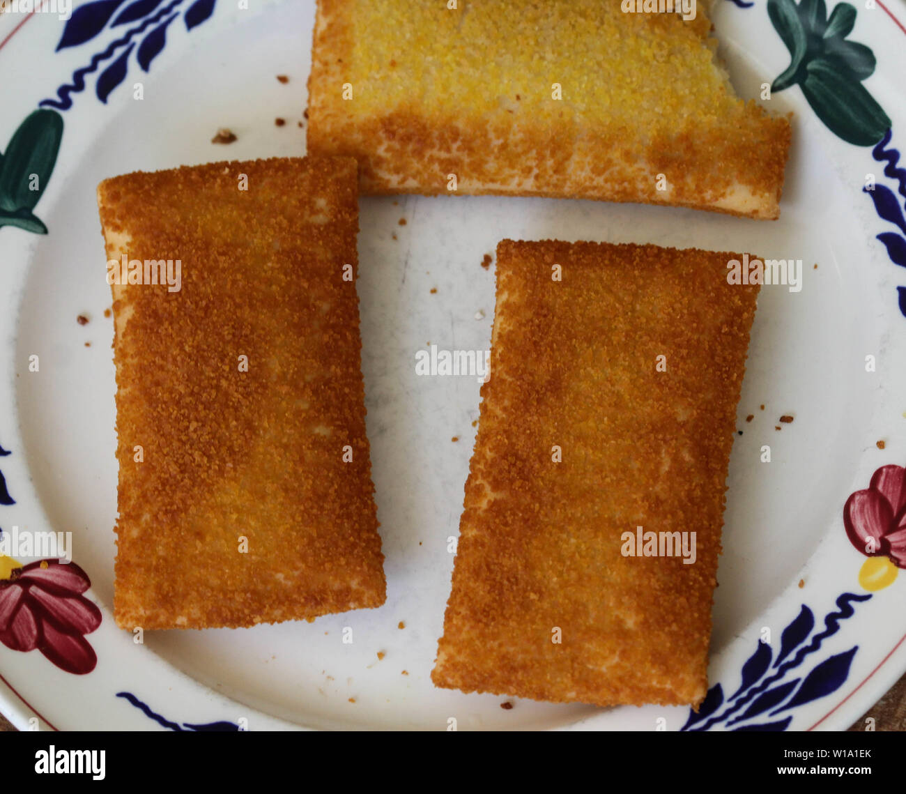 close up of kaassoufflé, a Dutch snack of melted cheese inside a thin ...