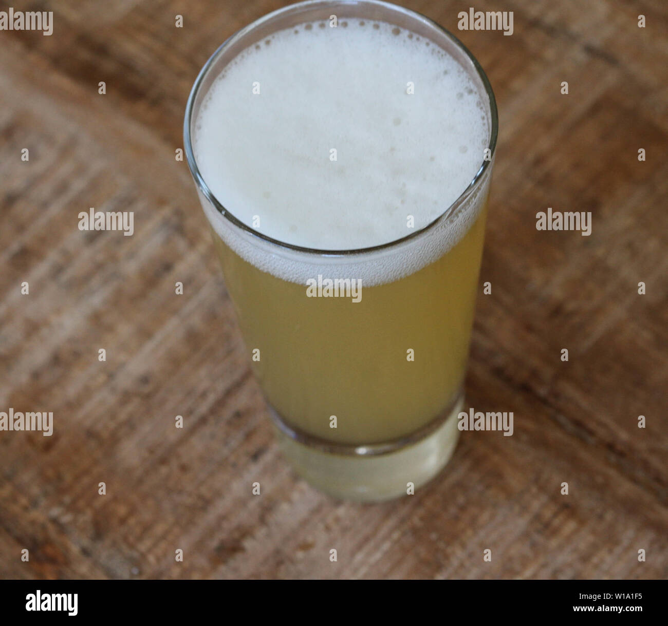 close up of glass filled with radler, mixture of beer and sparkling ...