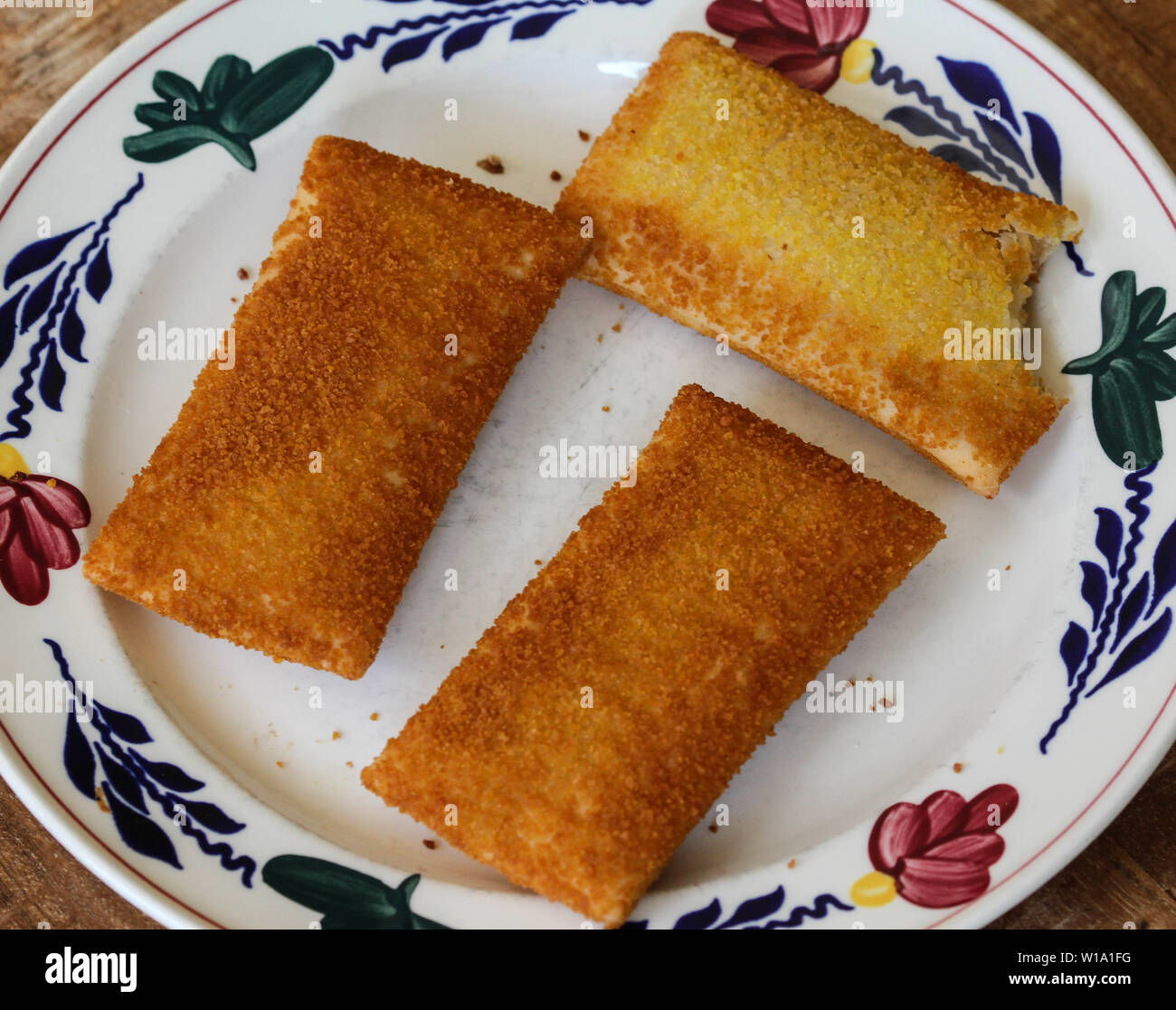 close up of kaassoufflé, a Dutch snack of melted cheese inside a thin ...
