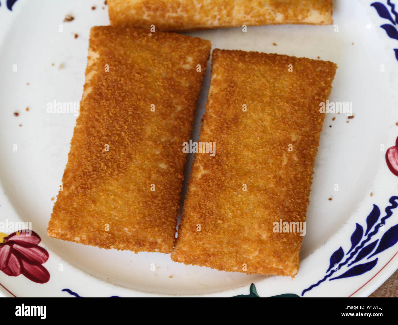 close up of kaassoufflé, a Dutch snack of melted cheese inside a thin ...