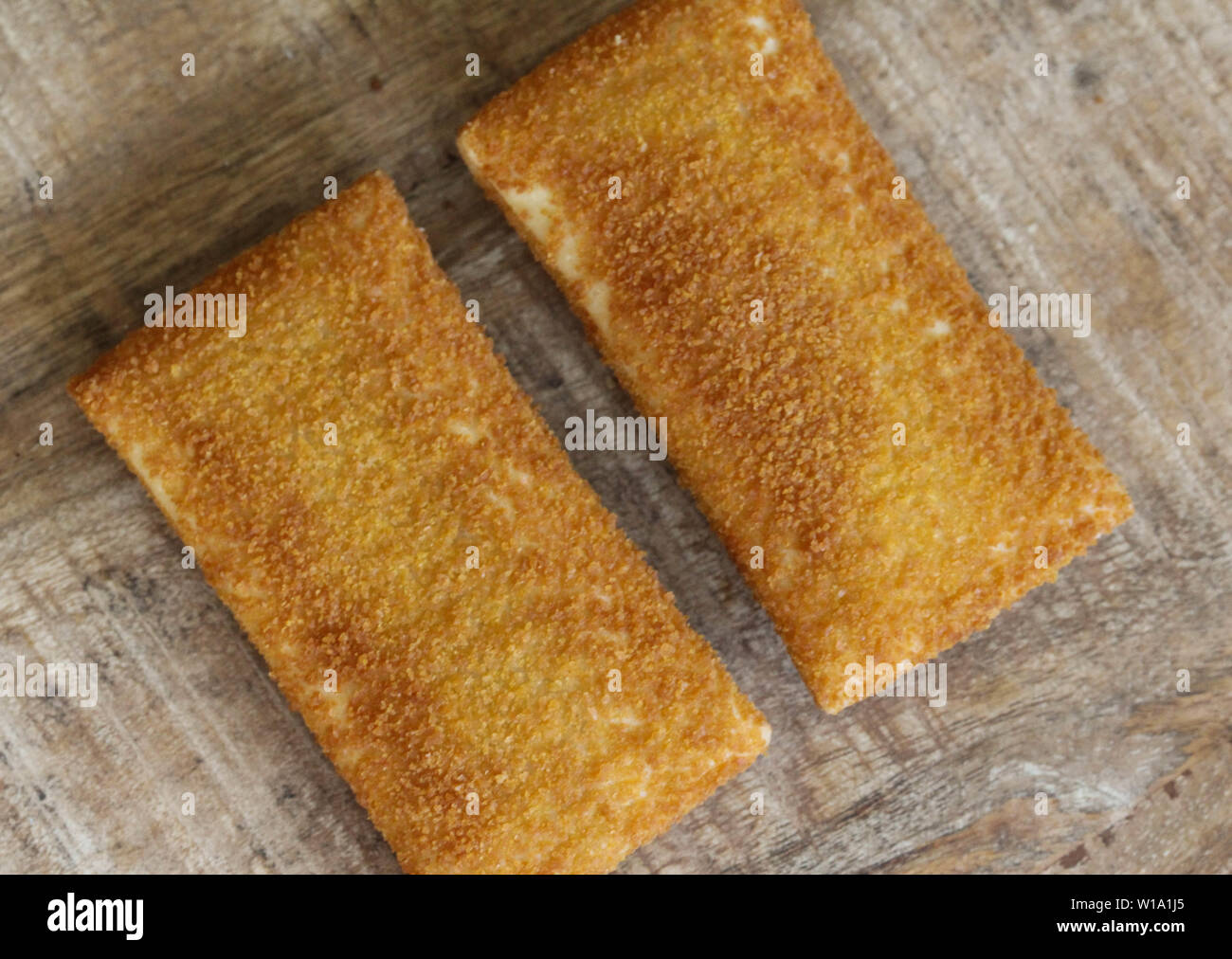 close up of kaassoufflé, a Dutch snack of melted cheese inside a thin ...