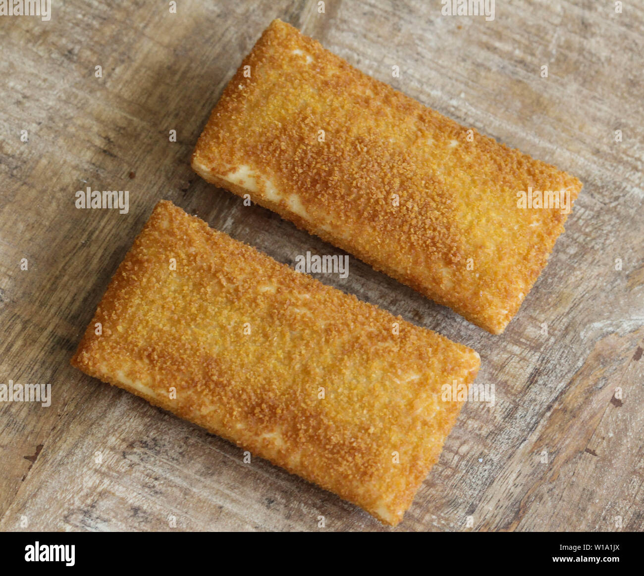 close up of kaassoufflé, a Dutch snack of melted cheese inside a thin ...