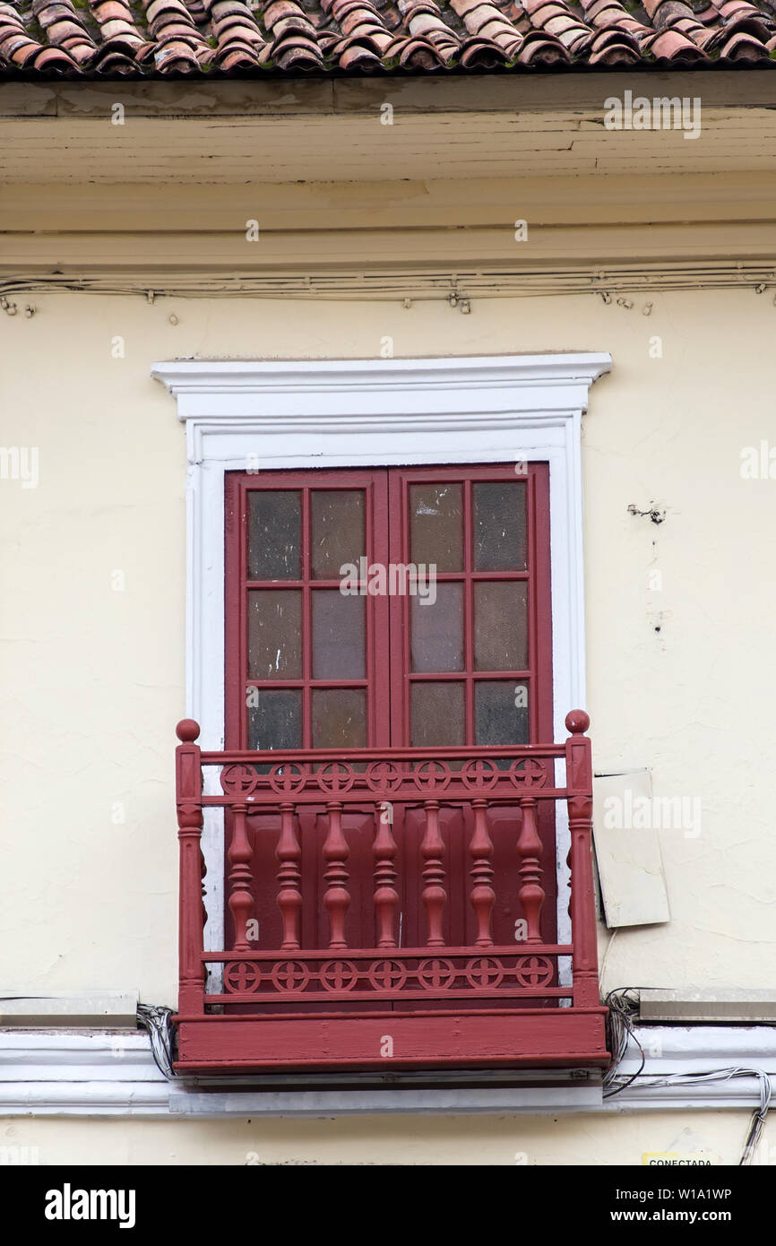 Red wooden sculptural wooden balcony, architectural detail on building ...
