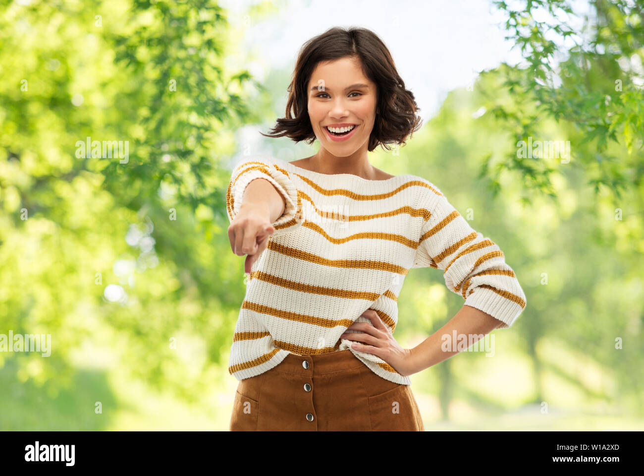 happy smiling woman pointing finger to you Stock Photo - Alamy