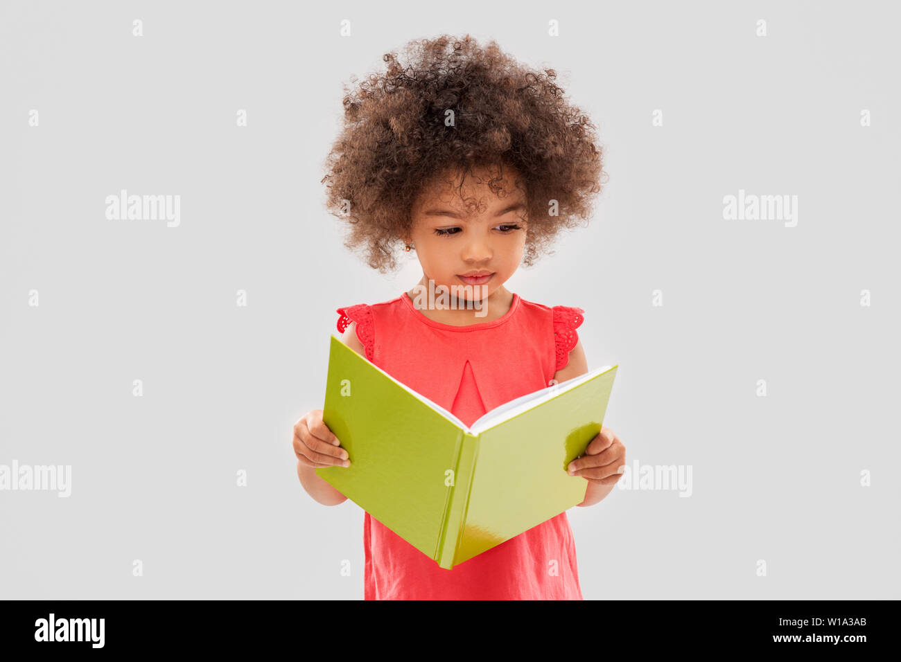 sad little african american girl reading book Stock Photo - Alamy sad little african american girl reading book Stock Photo - Alamy