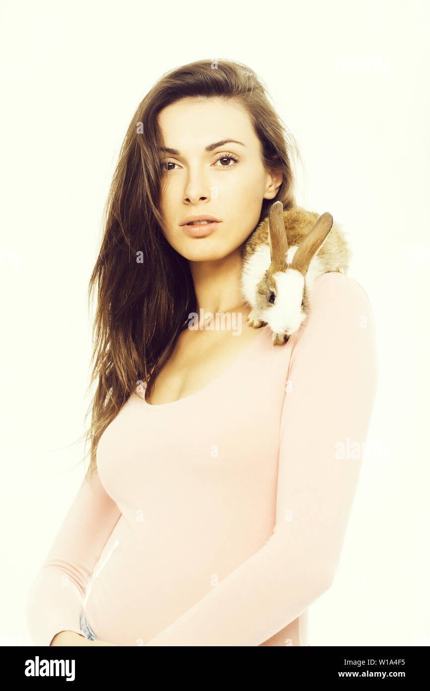 pretty woman with rabbit isolated Stock Photo - Alamy