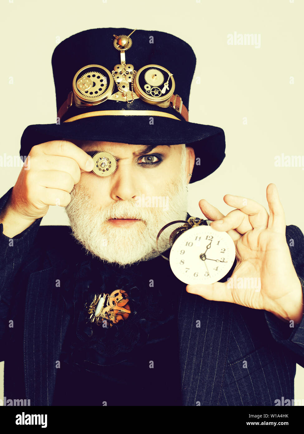 Old bearded man and clock hi-res stock photography and images - Alamy