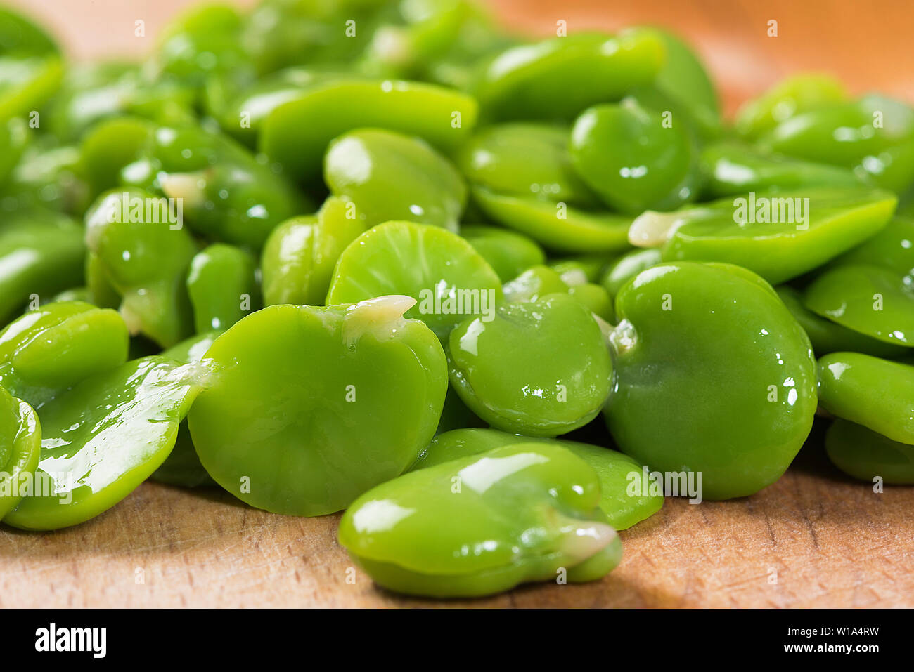 Close up of peeled broad beans, bright green, without skins Stock Photo ...