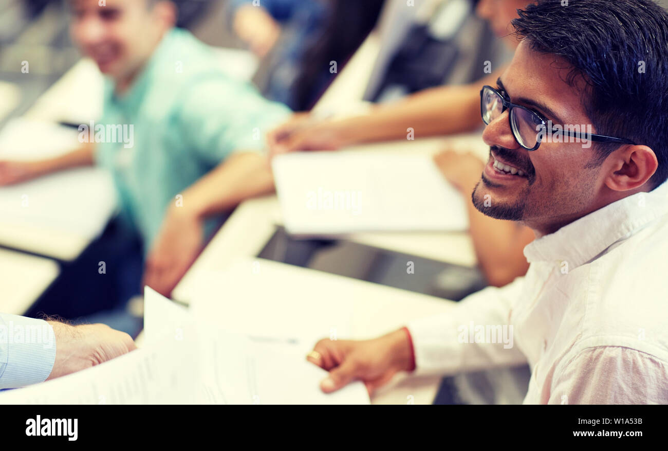 happy student with exam test or handout at lecture Stock Photo - Alamy