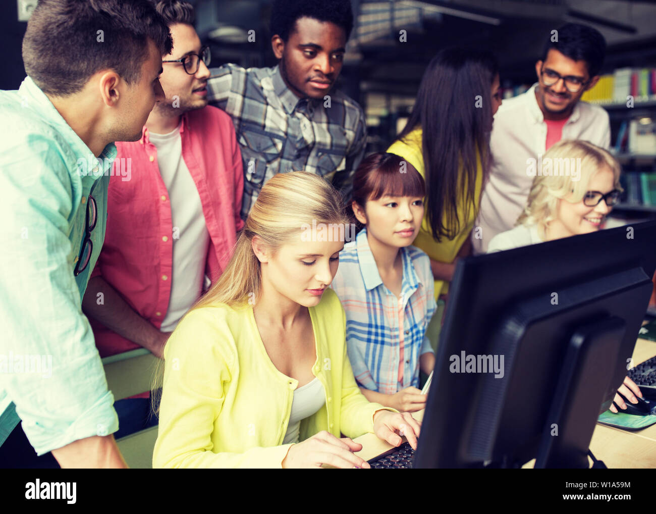 international students with computers at library Stock Photo - Alamy